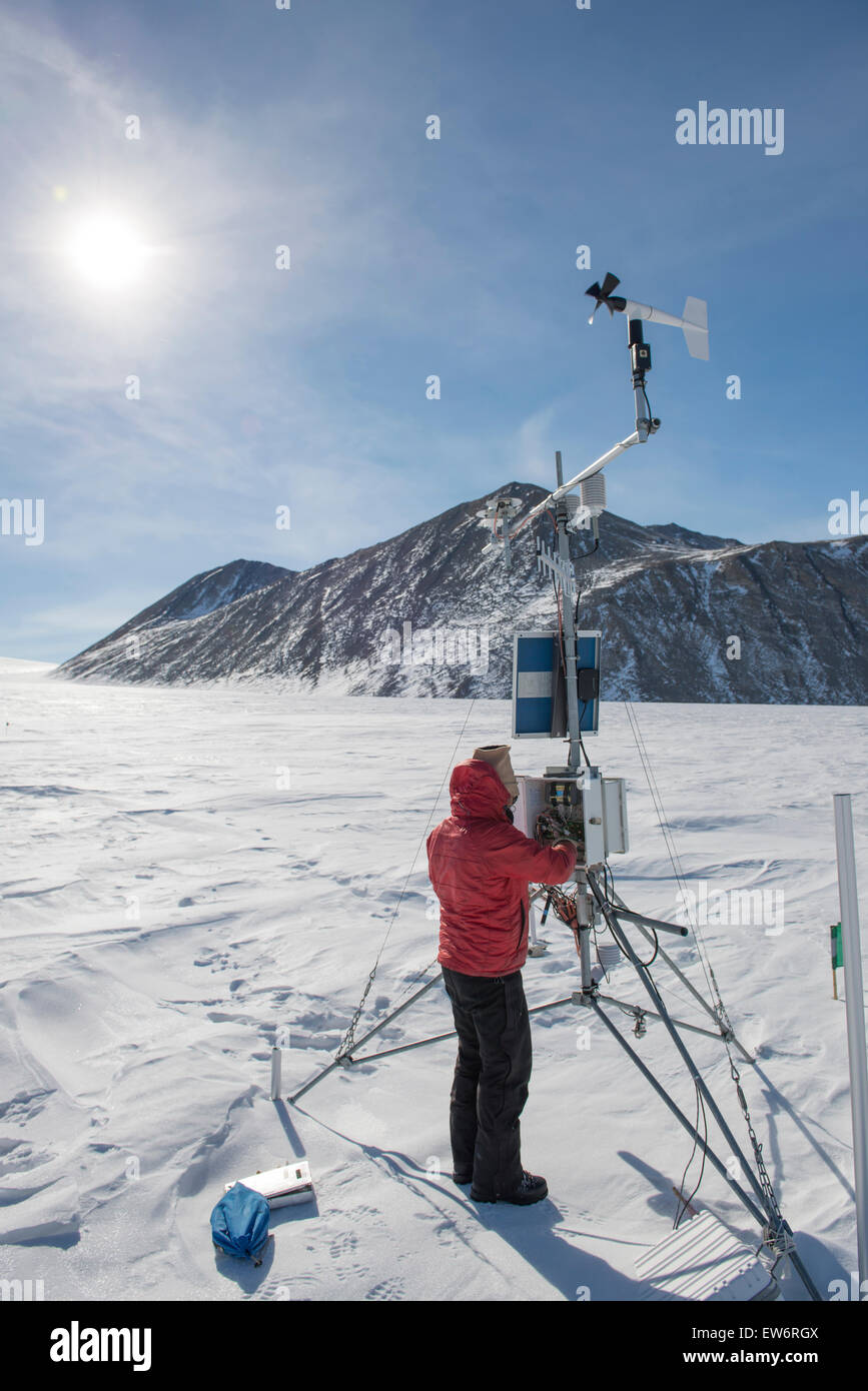A scientist works at a weather station located on the Comonwealth ...