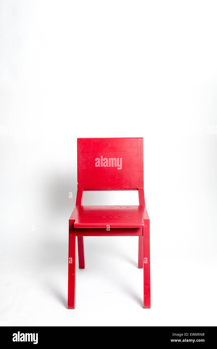 A red modernistic designer wooden chair Stock Photo - Alamy