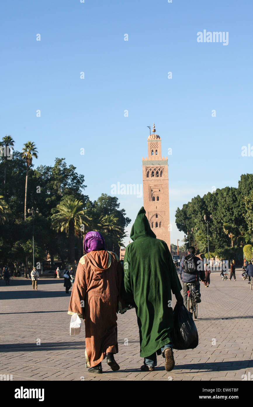 Locals wearing long hooded cloak known as a djellaba hi-res stock ...