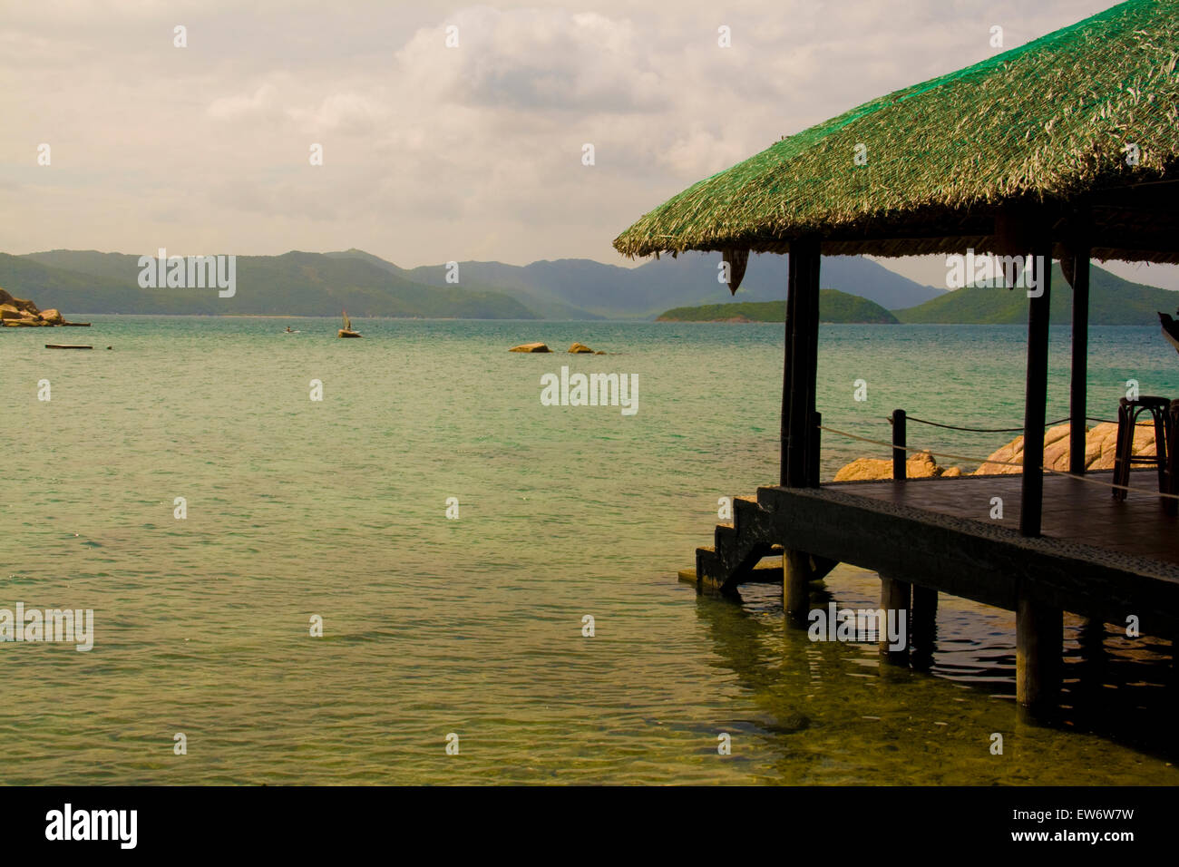 Beach bar with stairs leads to sea Stock Photo - Alamy
