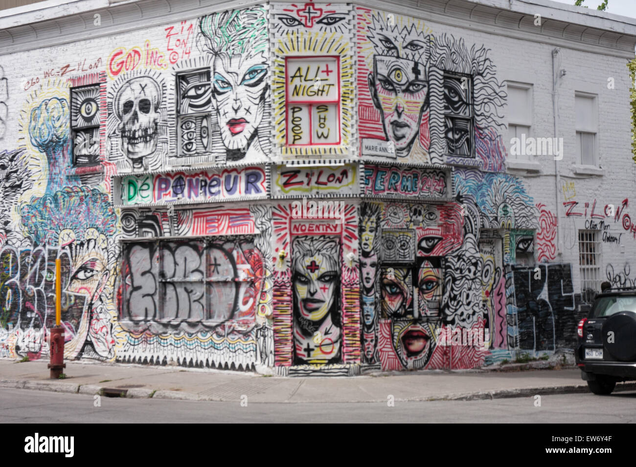 A picture of a Corner building with colorful graffitis covering all ...