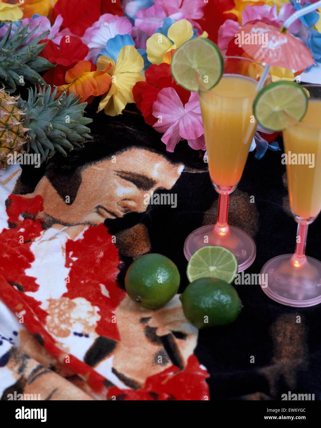 Close-up of glasses of fruit cocktails on a Hawaiian Elvis themed tray ...