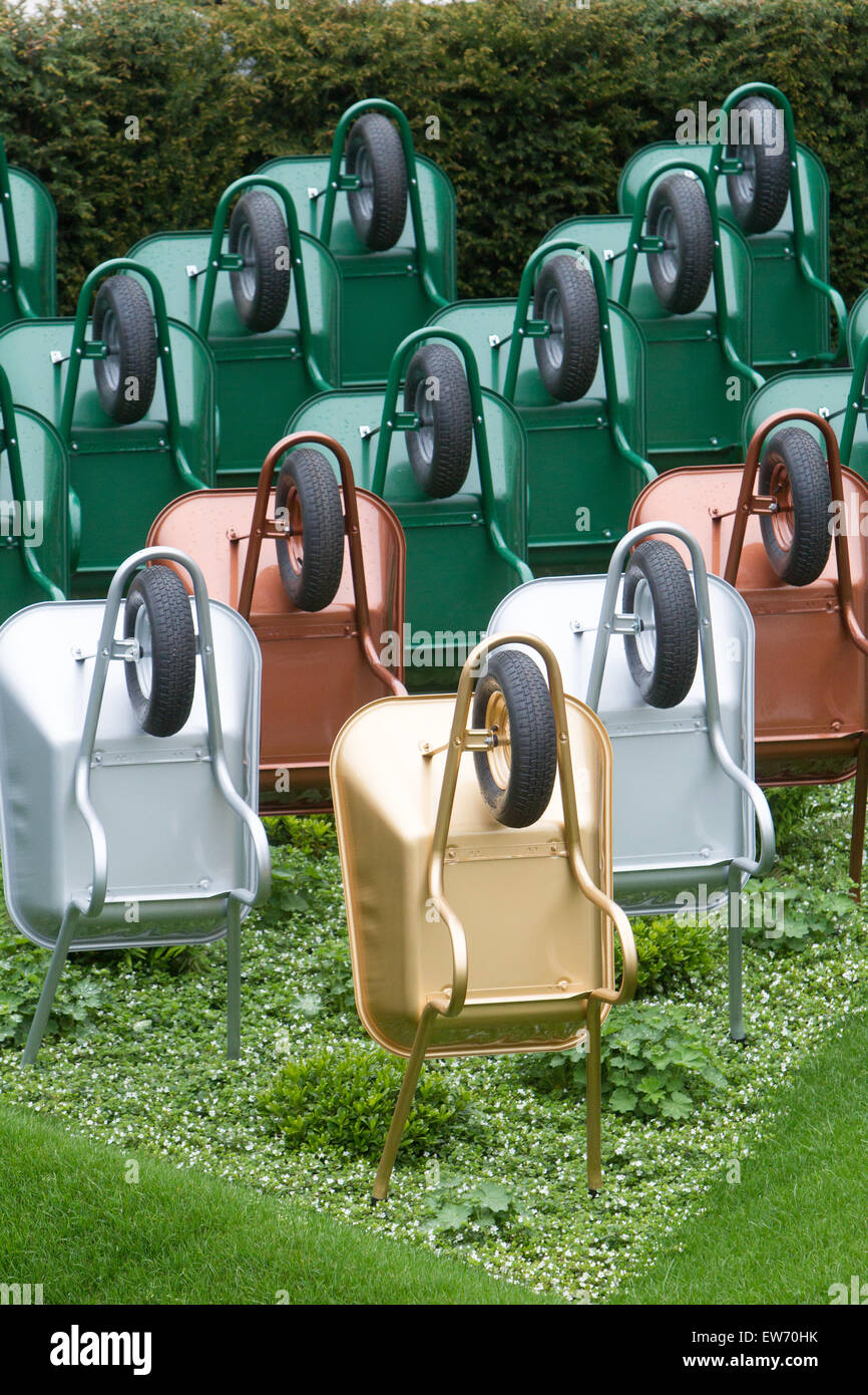 Painted wheelbarrows in a novelty art installation Stock Photo - Alamy