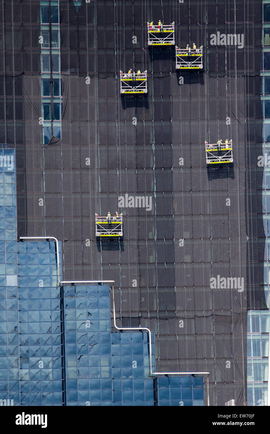 Cleaners in cradles on high rise building in London Stock Photo - Alamy