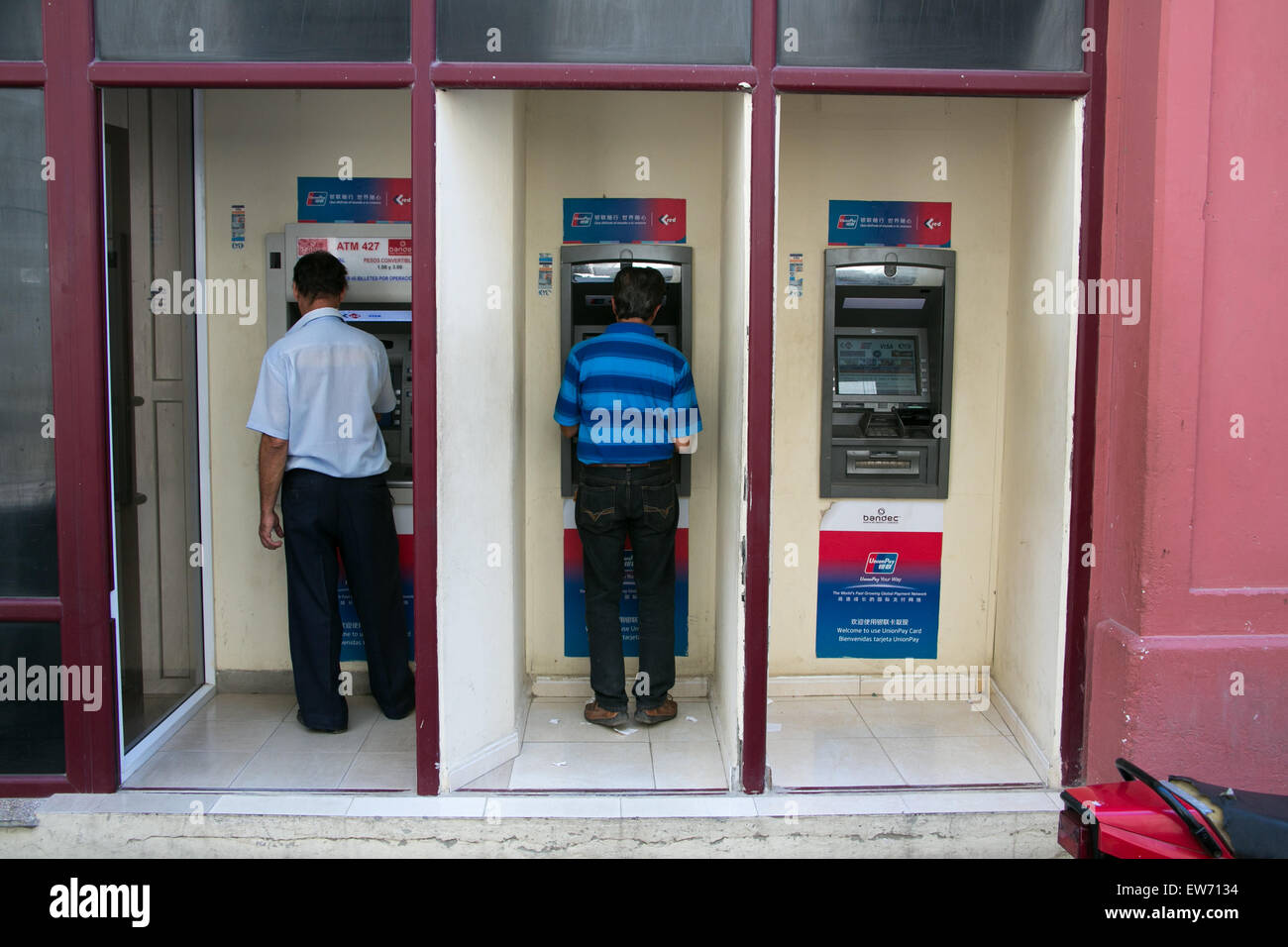 Men using ATM machines on the streets of Old Havana, Cuba Stock Photo ...