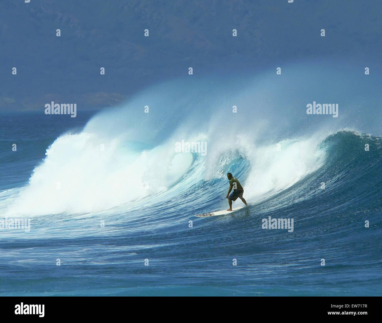 A surfer in strong wind and water spume Stock Photo - Alamy