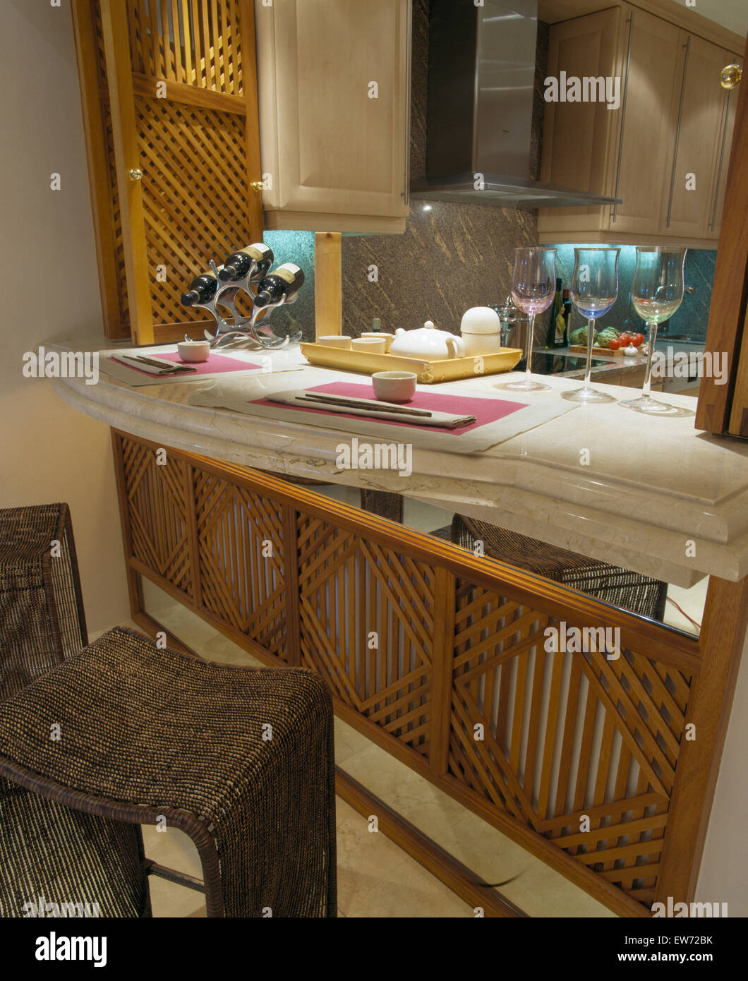 Wicker stool at breakfast bar in modern Spanish villa Stock Photo - Alamy