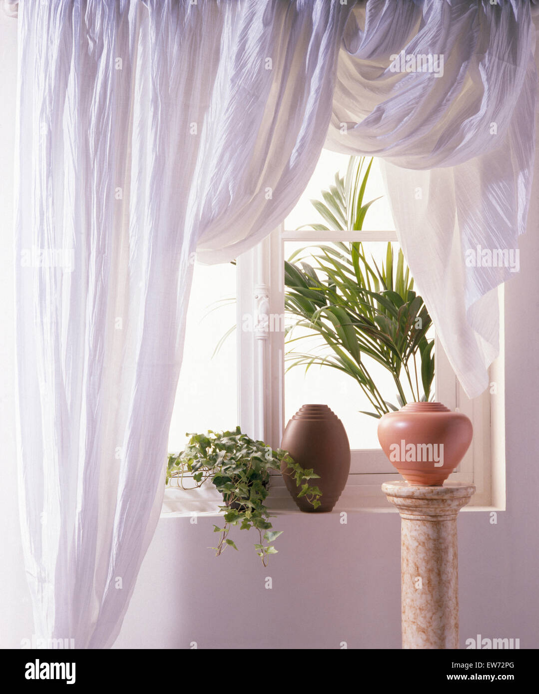 Draped white fabric on window in eighties room Stock Photo - Alamy