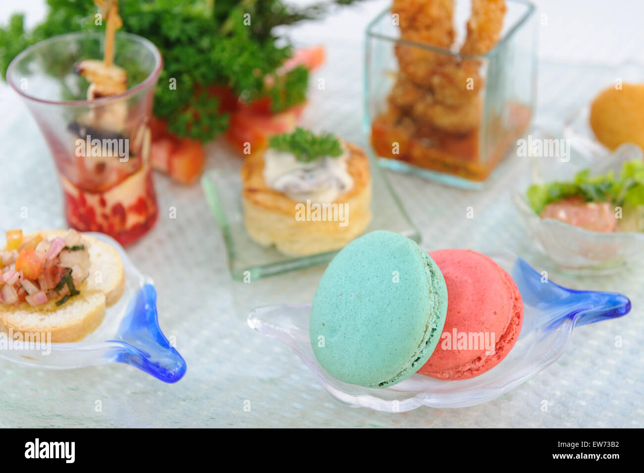 A selection of canapés including macarons and vol-au-vents Stock Photo ...