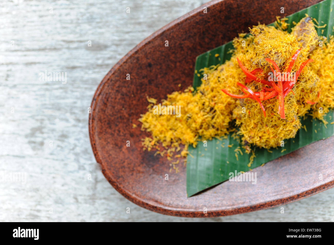 Indonesian style beef rendang served with sautéed coconut, and red ...