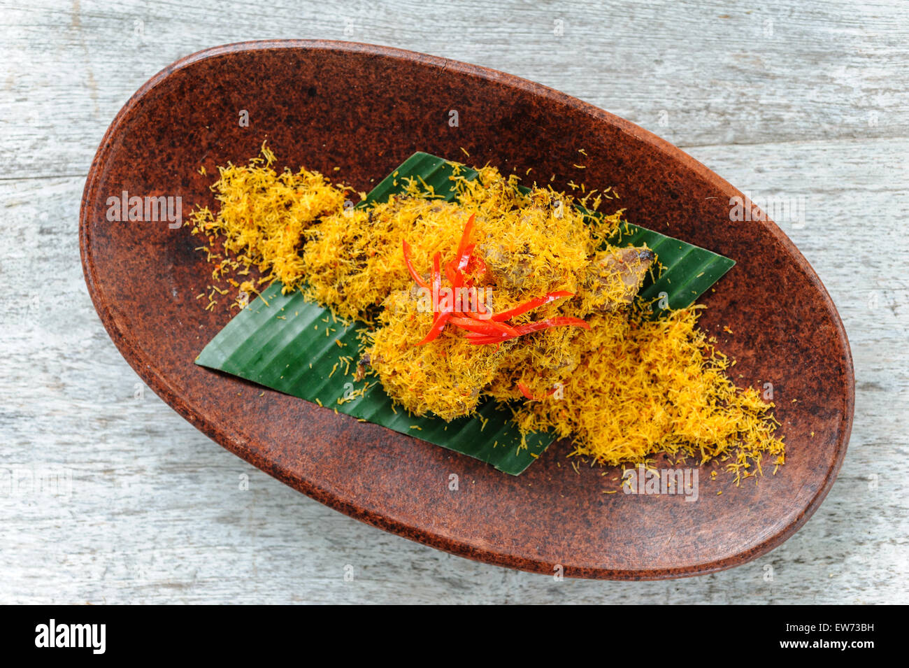 Indonesian style beef rendang served with sautéed coconut, and red ...