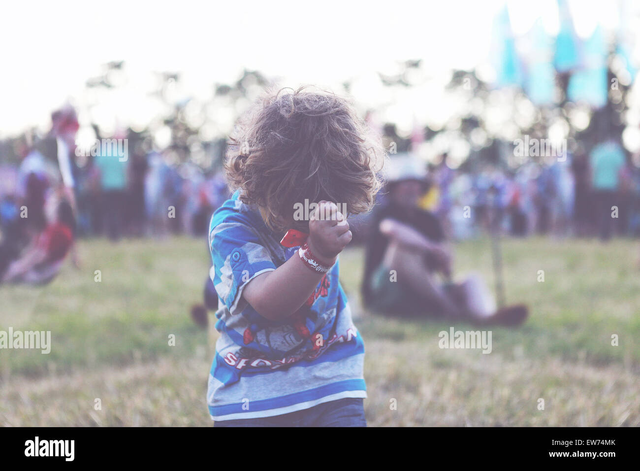 Little boy dancing at music festival Stock Photo - Alamy
