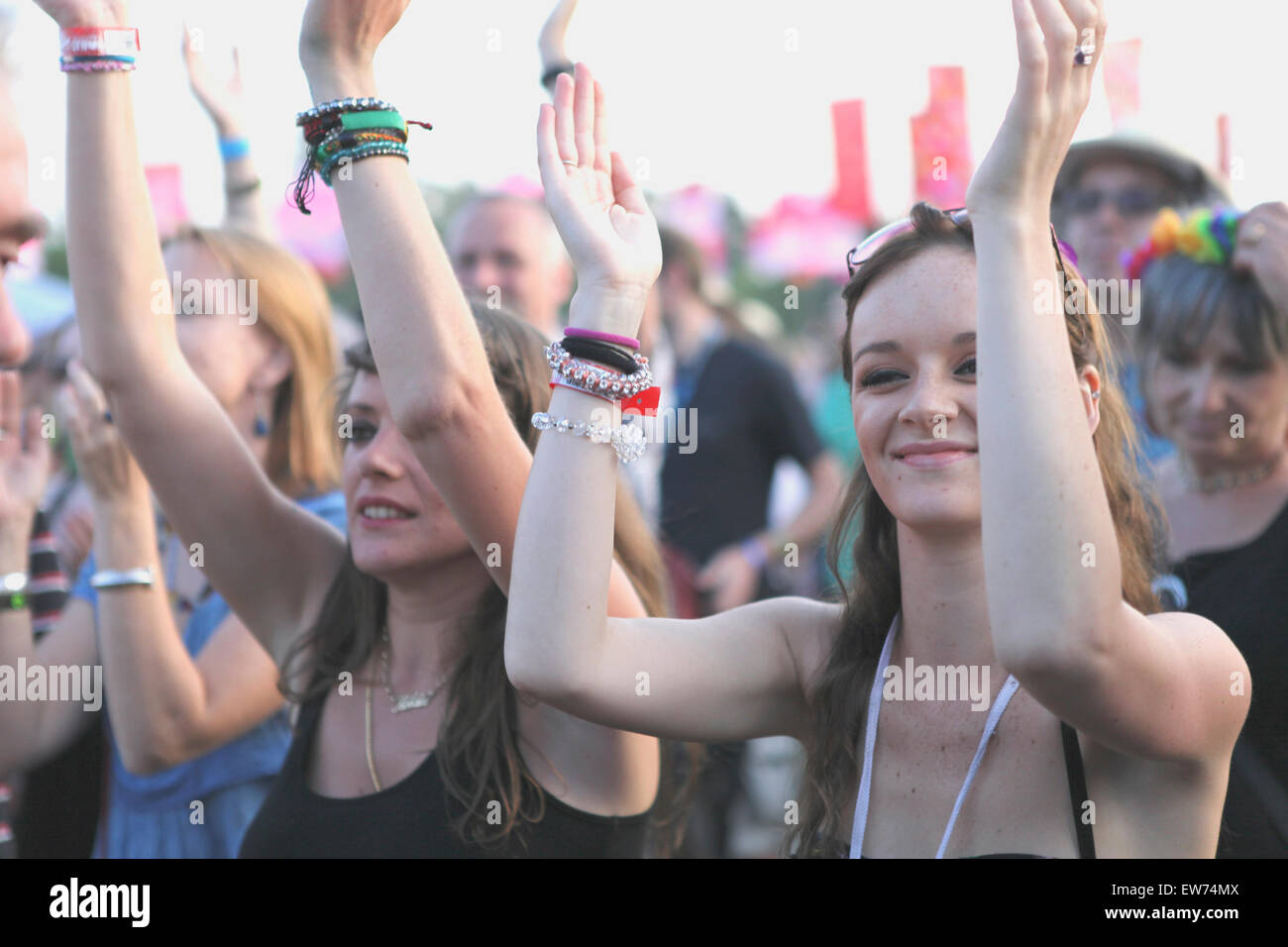 Girls in crowd cheering at music festival Stock Photo - Alamy