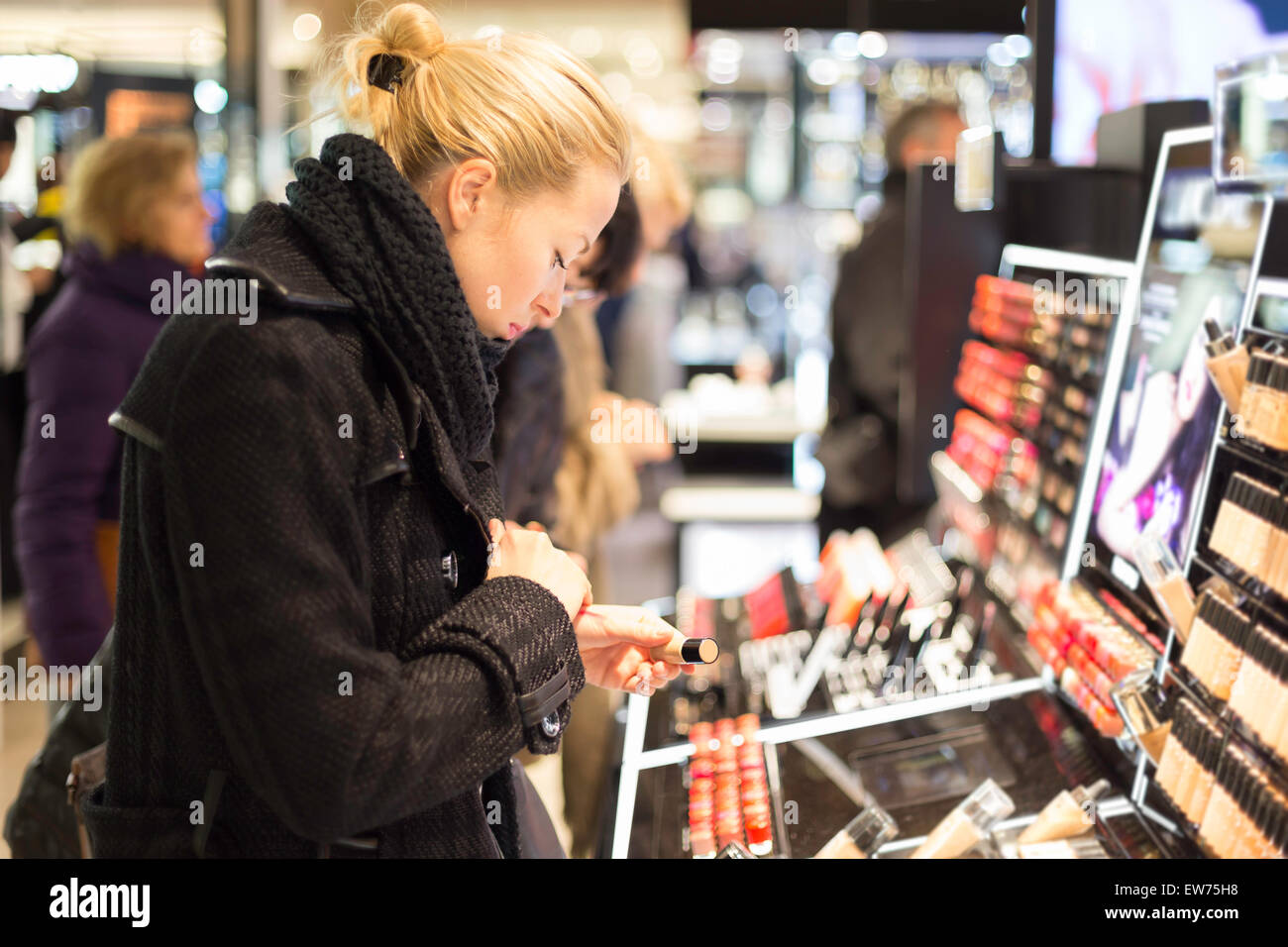 Girl looking cosmetics in a store hi-res stock photography and images ...