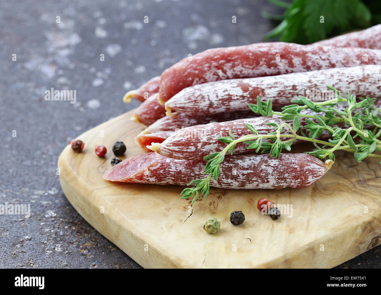 thin salami sausage snack with herbs and spices Stock Photo - Alamy