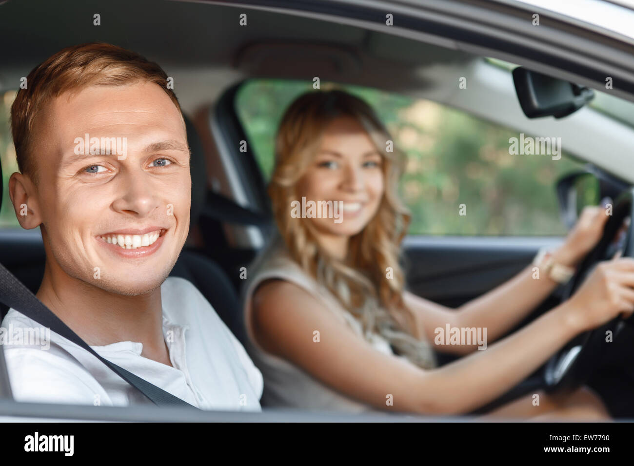Young couple in the car Stock Photo - Alamy