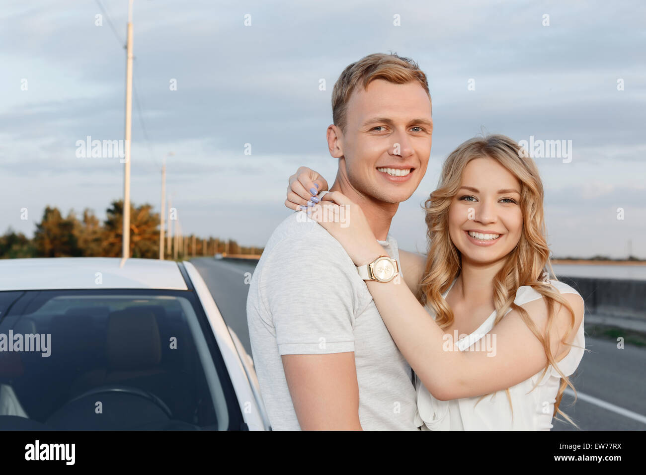 Lovely couple near the car Stock Photo - Alamy