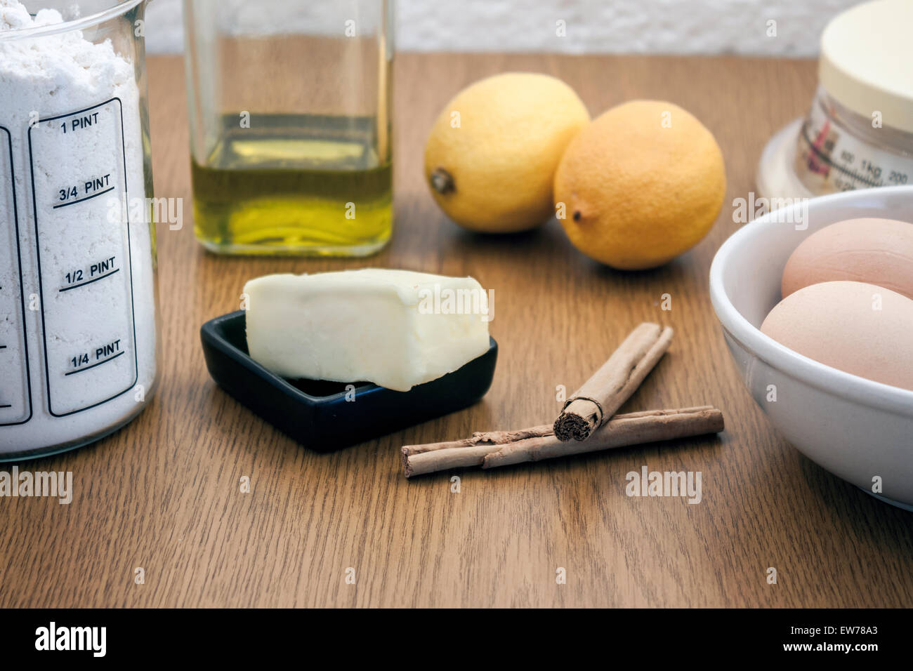 some of the ingredients needed for baking a cake and some of the tools ...