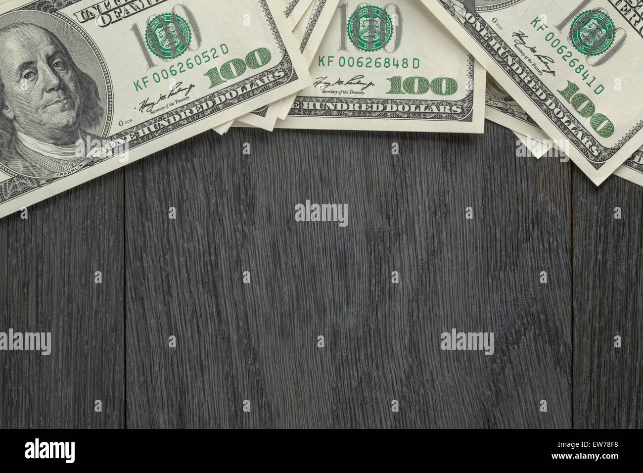 border from dollar bills on wooden table Stock Photo - Alamy