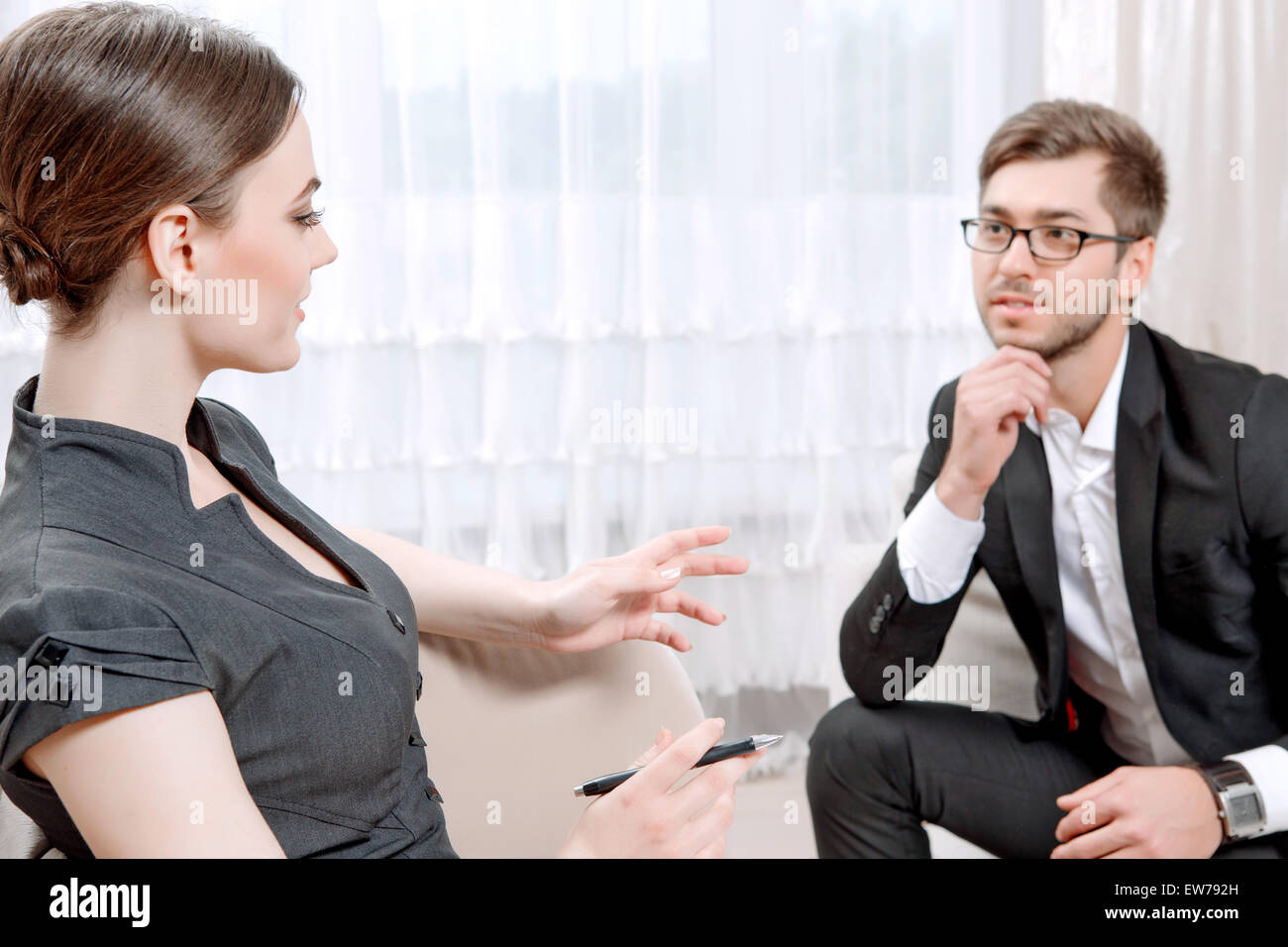 Young man with his psychologist Stock Photo - Alamy