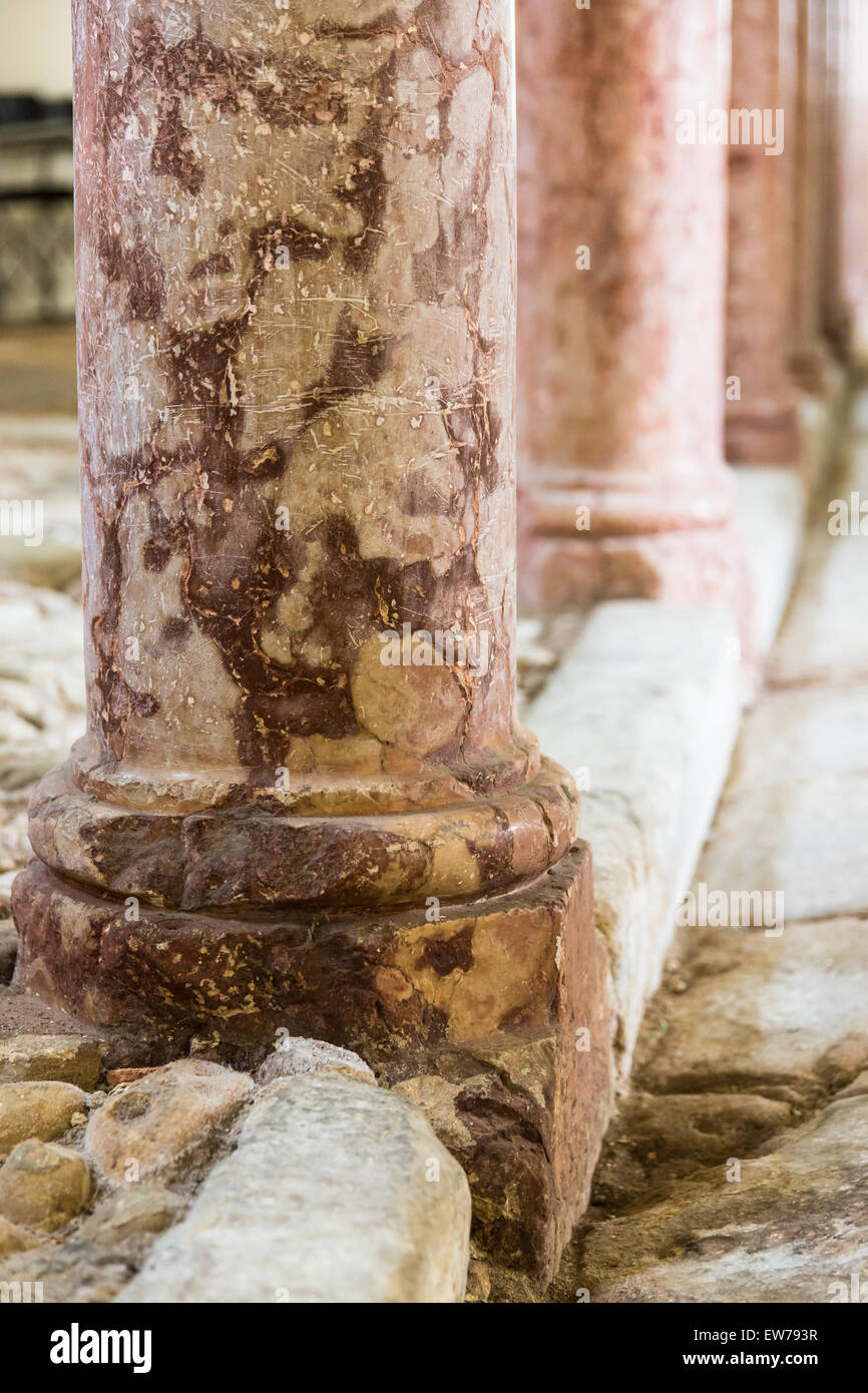 antique red marble columns resting on stone floor Stock Photo - Alamy