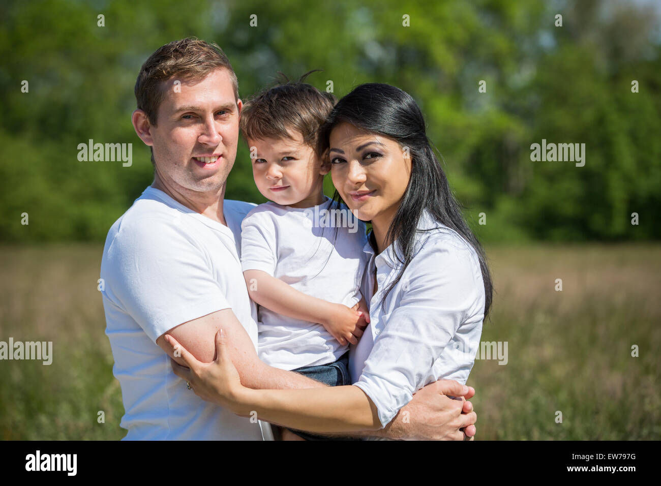 Family with one child Stock Photo - Alamy