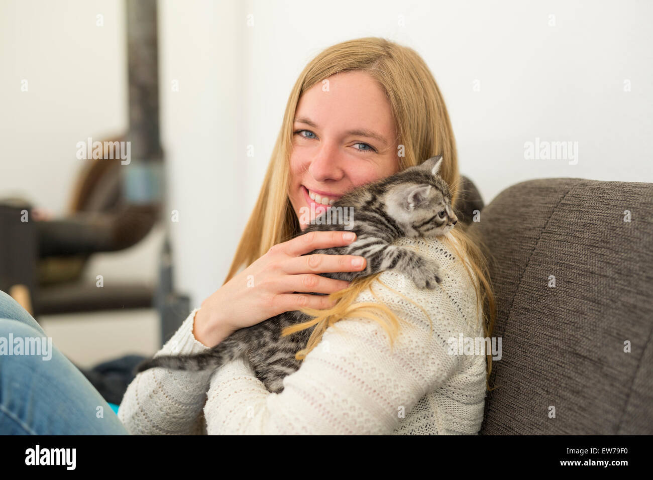 Young woman with kitten Stock Photo - Alamy