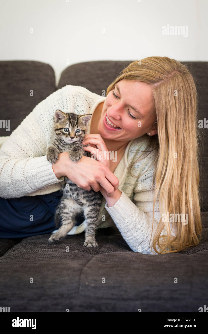 Young woman with kitten Stock Photo - Alamy