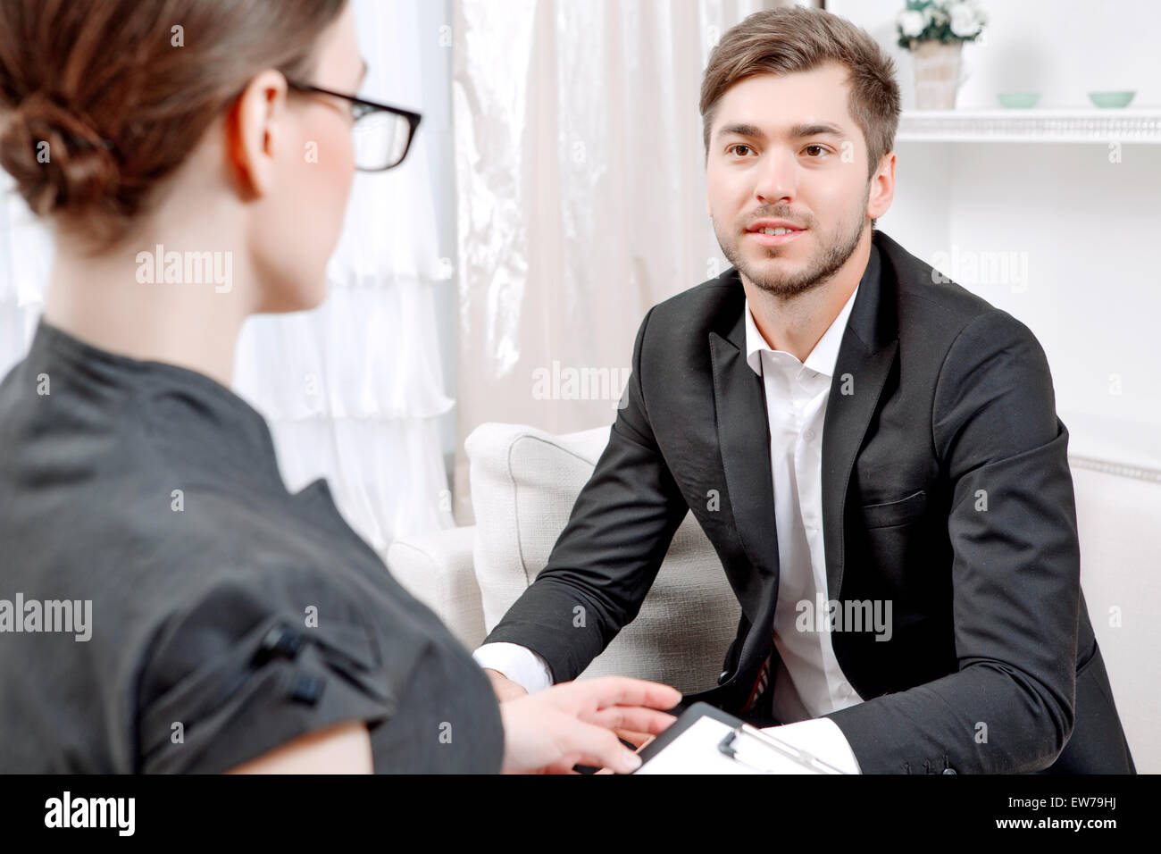 Young man with his psychologist Stock Photo - Alamy