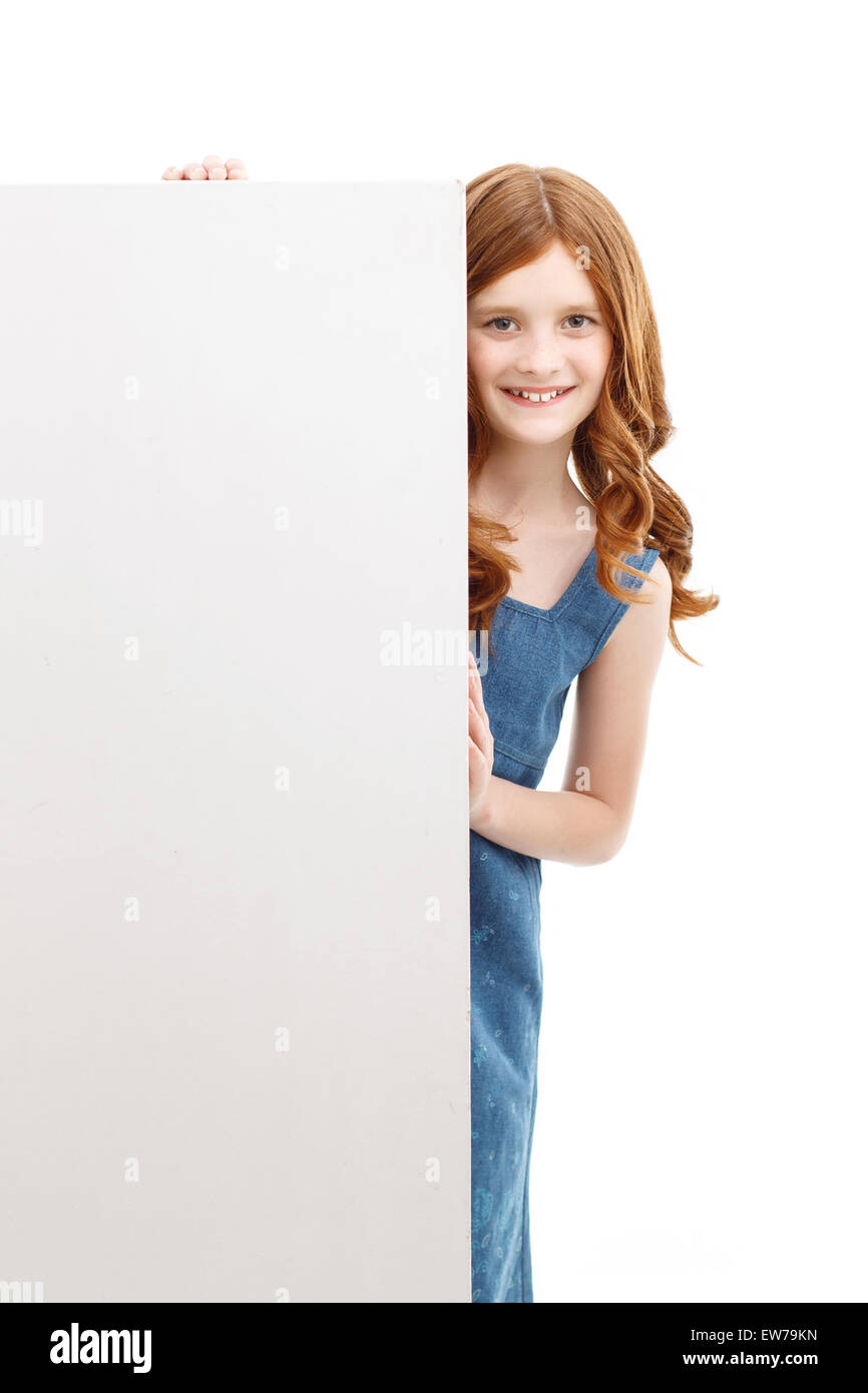 Pretty little girl looking out of box Stock Photo - Alamy