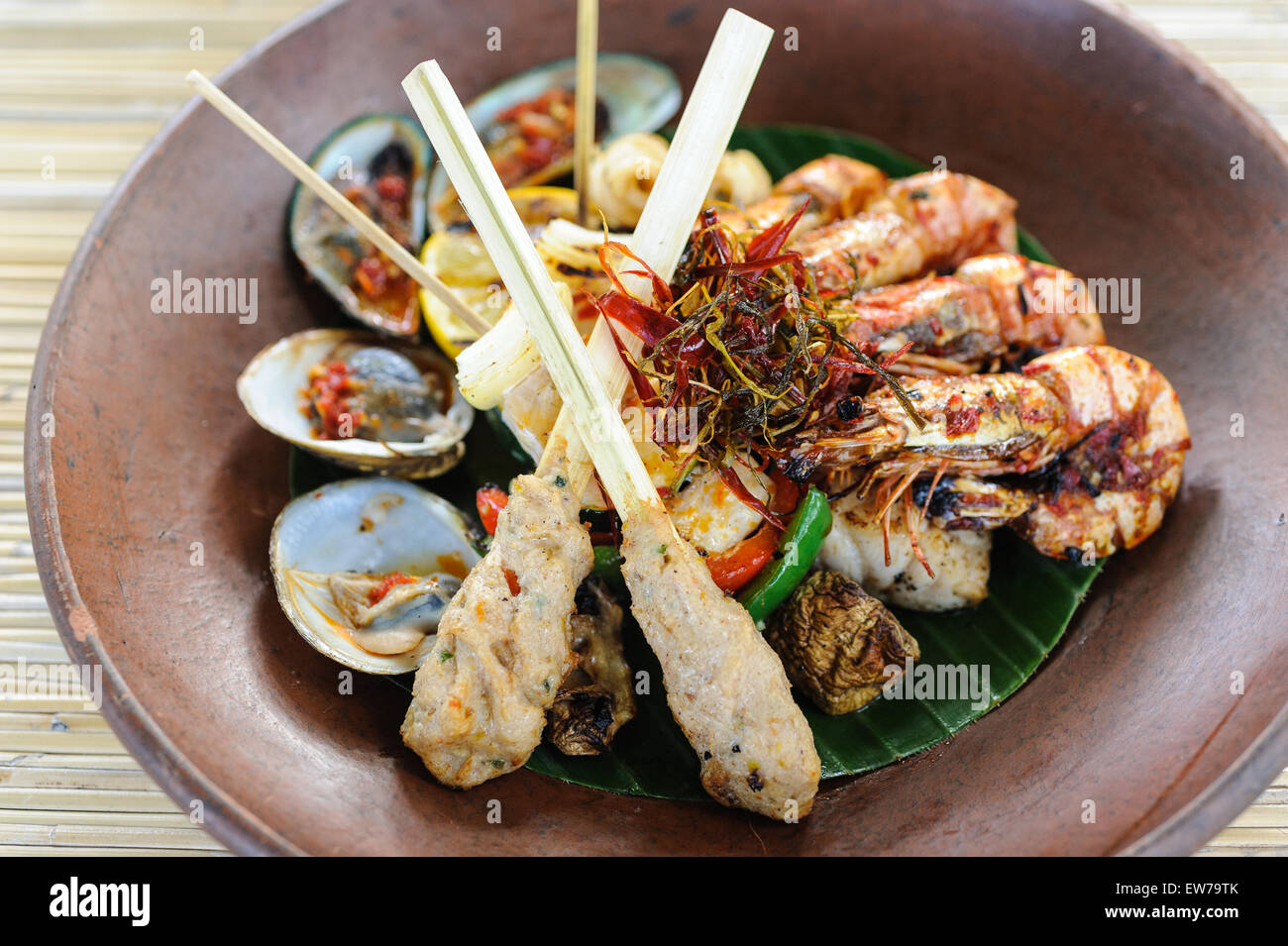 Indonesian style seafood with fish sate, grilled prawns and shellfish ...