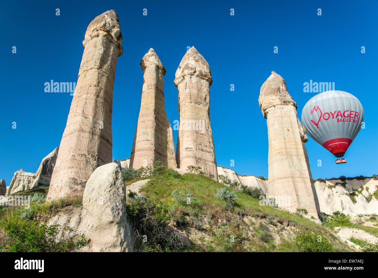 Scenic fairy chimneys landscape with hot air balloon, Goreme ...