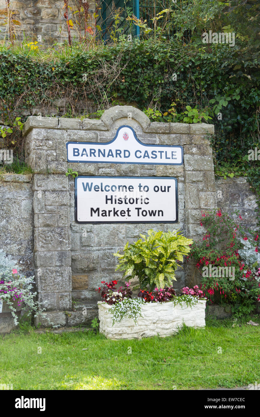 Welcome sign set in the shadow of the castle ruins at Barnard Castle ...