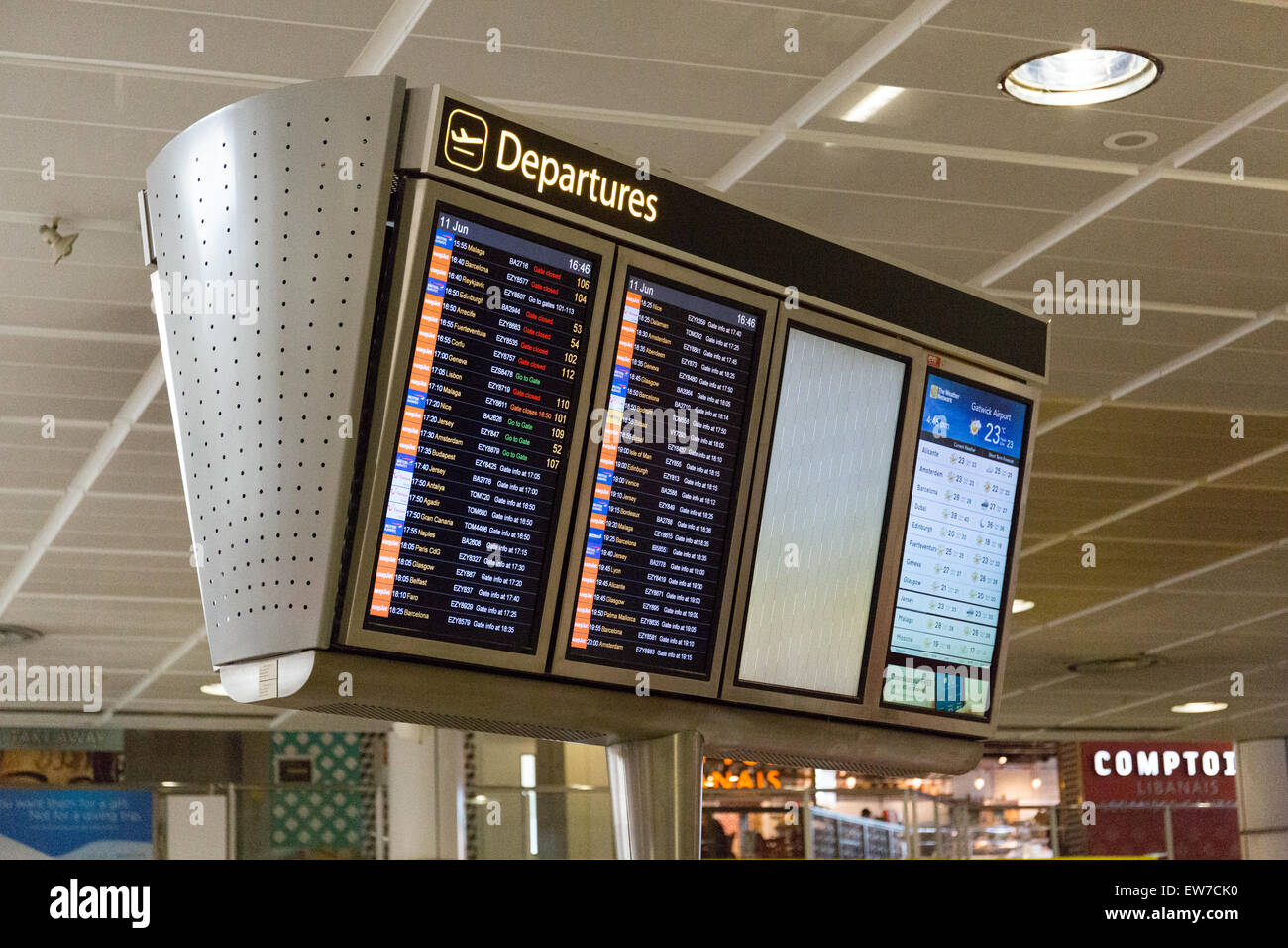 Departure monitor at the North Terminal of London Gatwick airport ...
