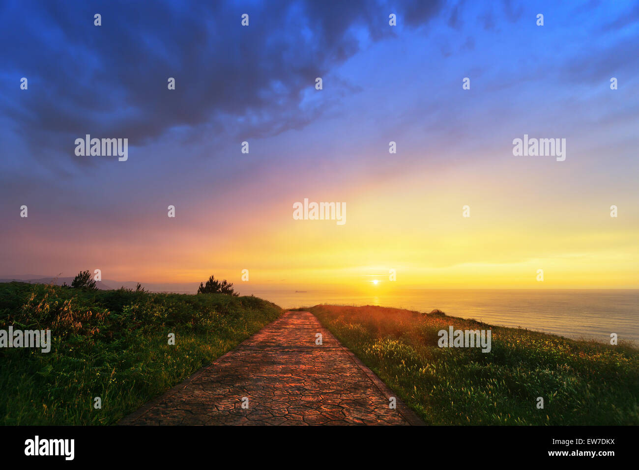 Path to the sea with beautiful sunset Stock Photo - Alamy