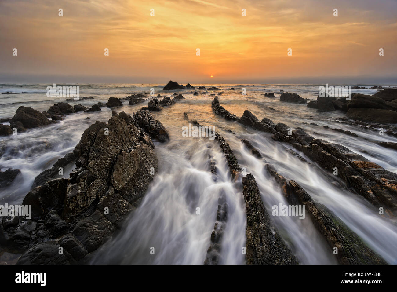 Barrika beach at sunset with golden warm light Stock Photo - Alamy