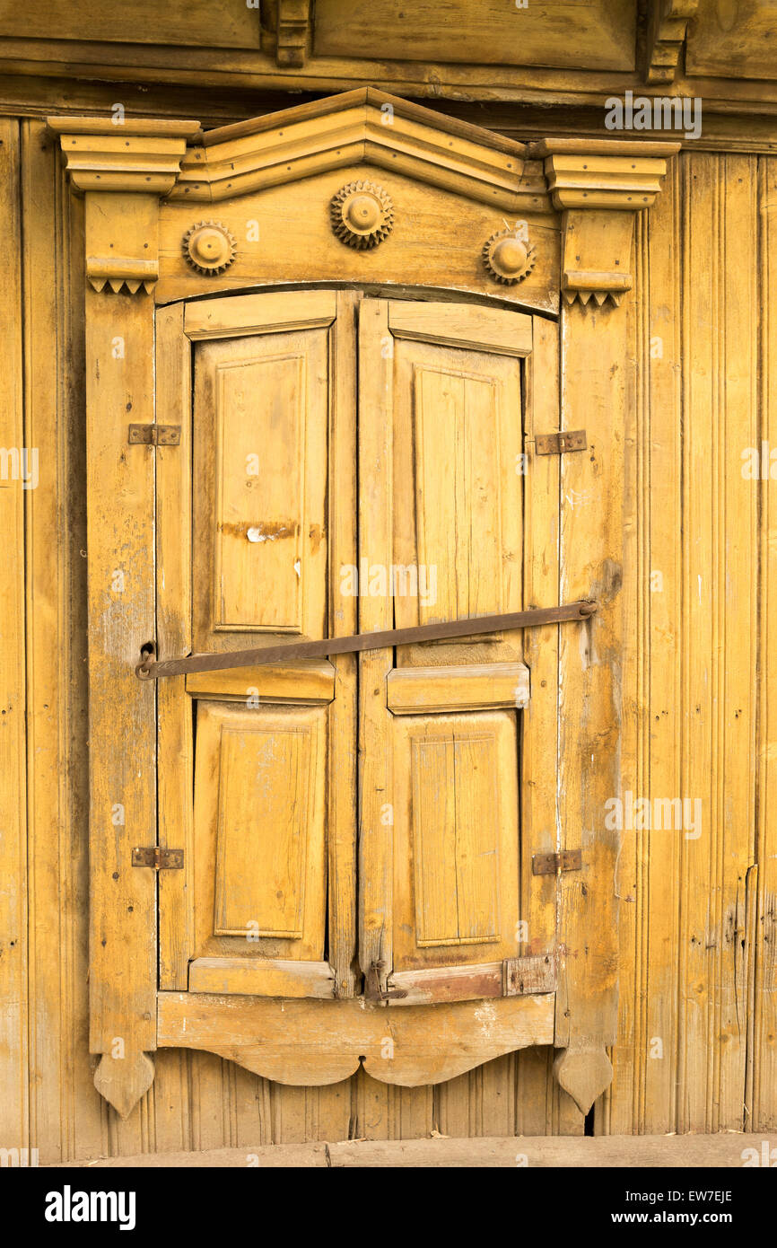 Orange colored traditional wooden Russian window frame in hand carved ...