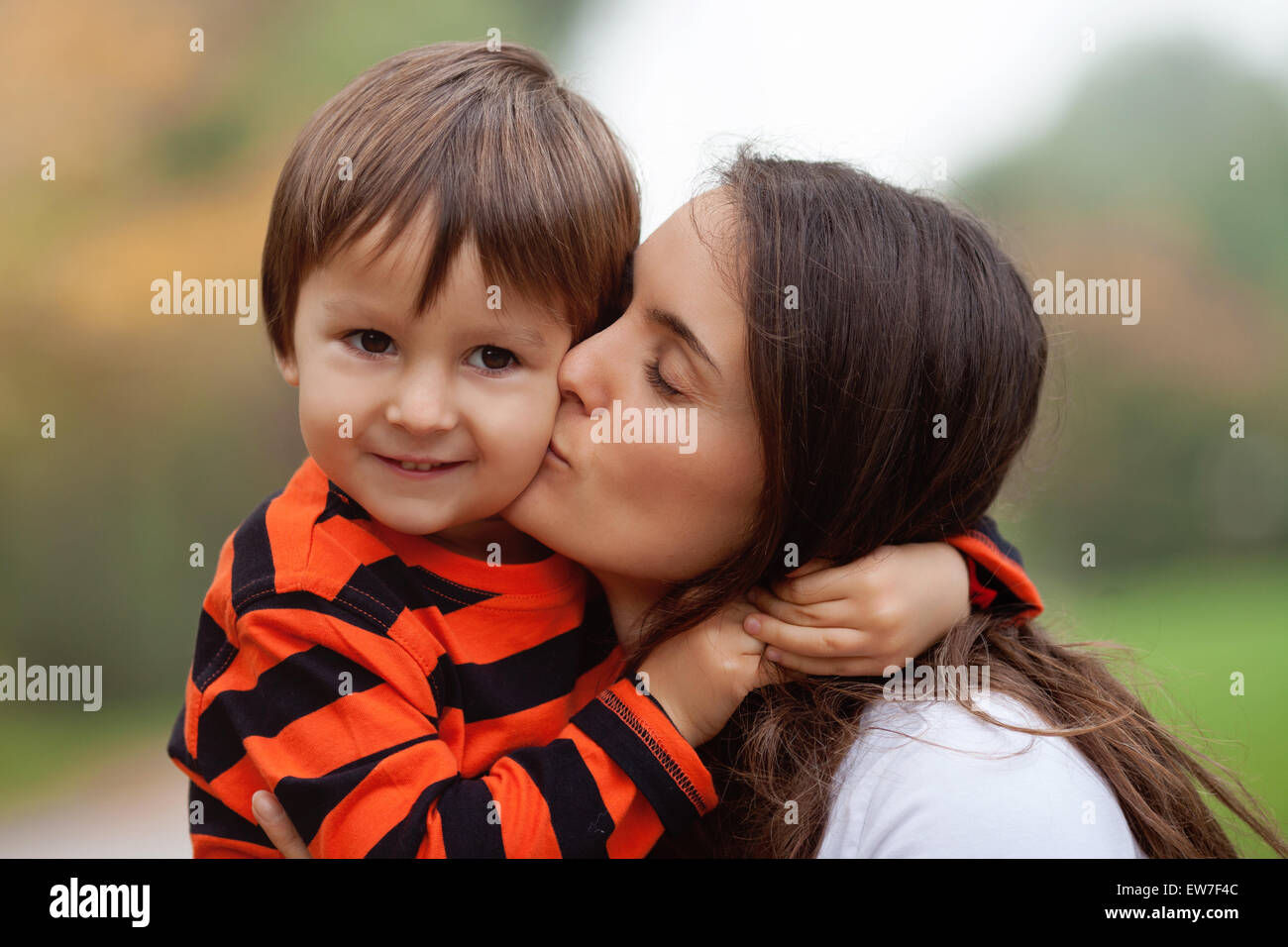 Kid playing isolated portrait. Young mother her boy outdoor in the park Stock Photo - Alamy