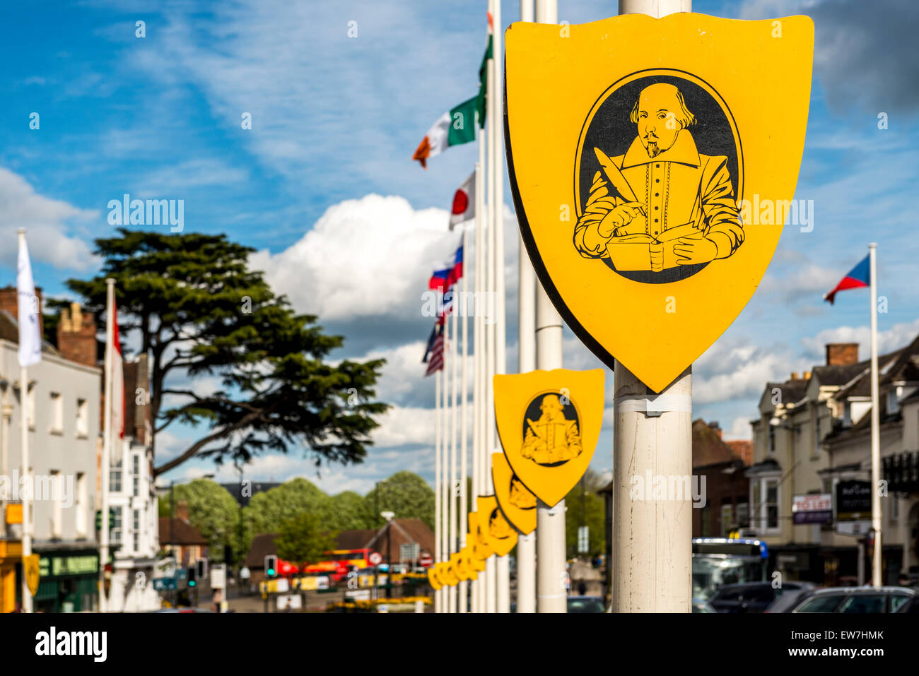 The image of William Shakespeare writing a play appears on shields on ...