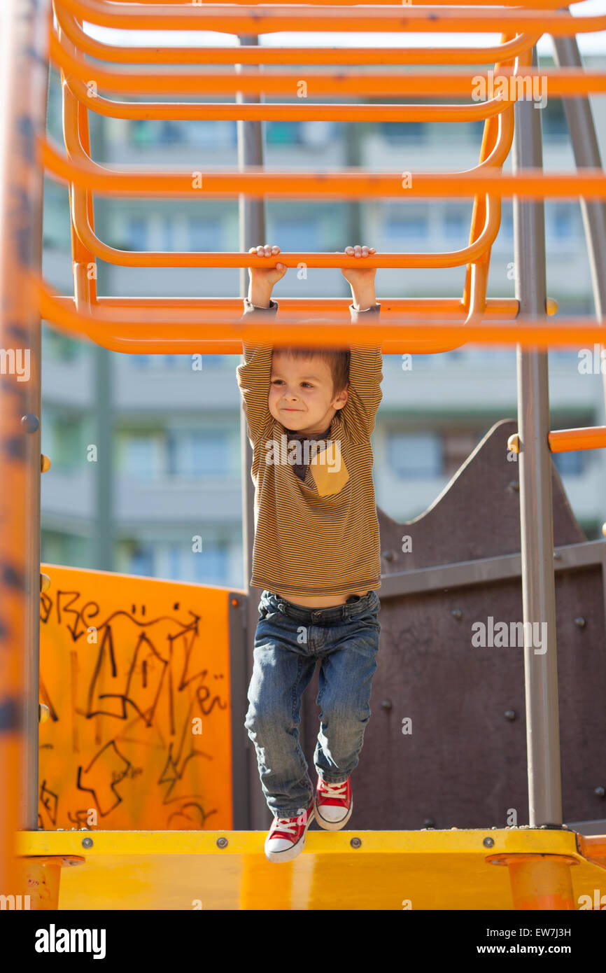 Kids, playing on the playground, having fun Stock Photo - Alamy