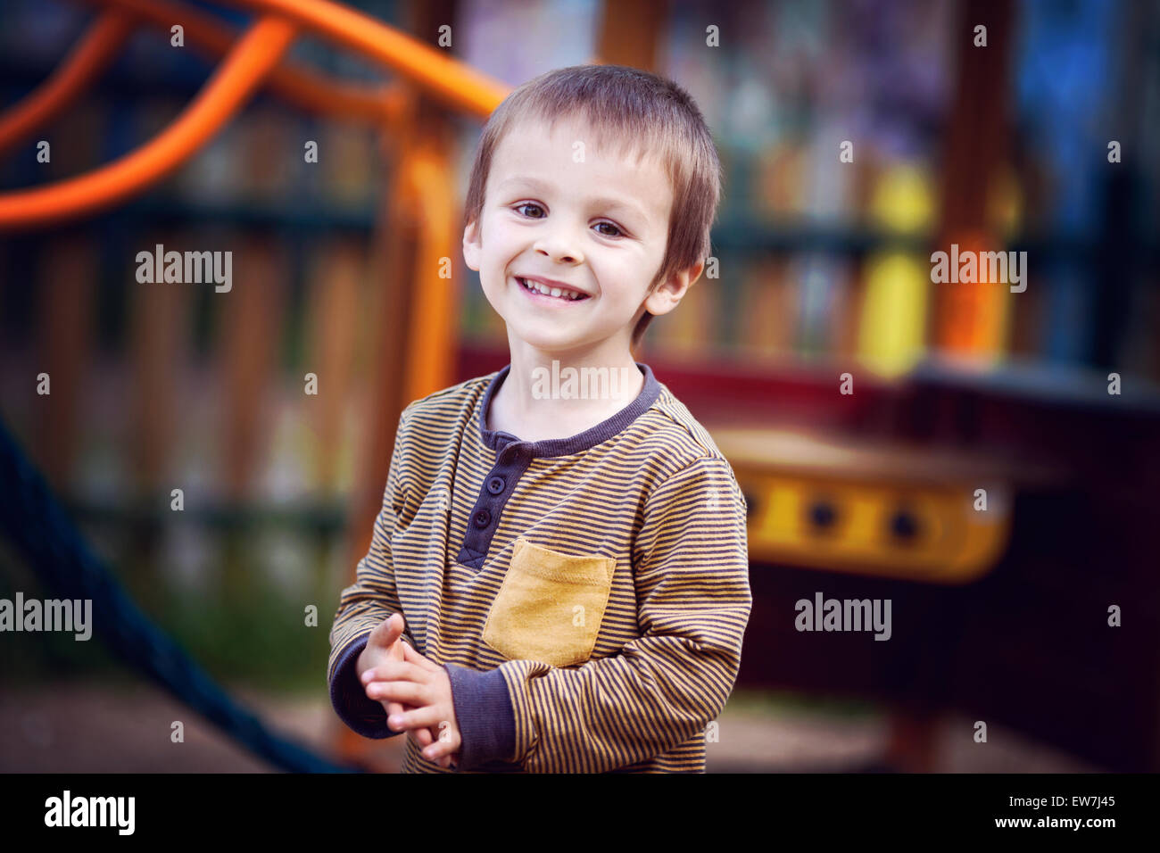 Kids, playing on the playground, having fun Stock Photo - Alamy
