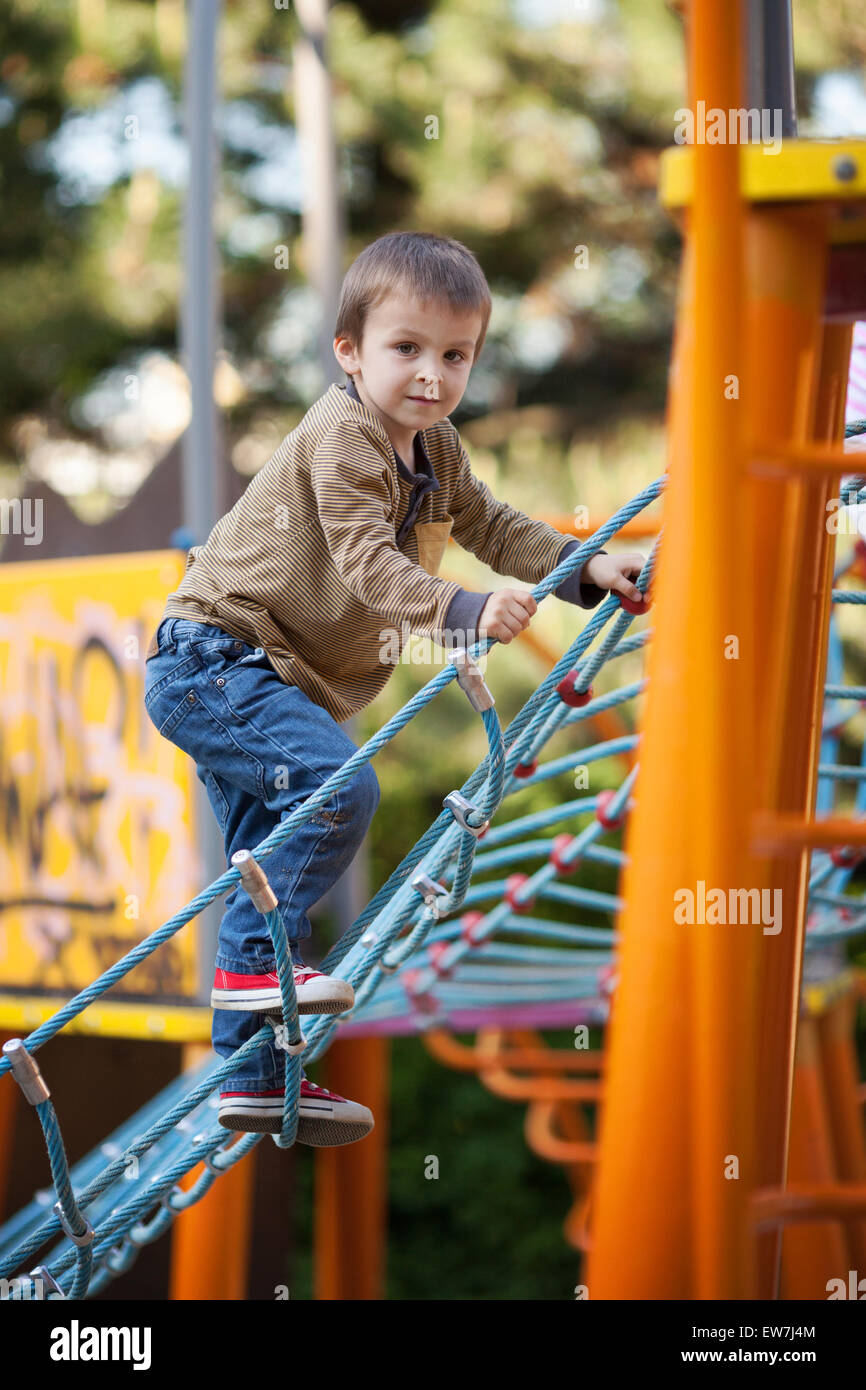 Kids, playing on the playground, having fun Stock Photo - Alamy