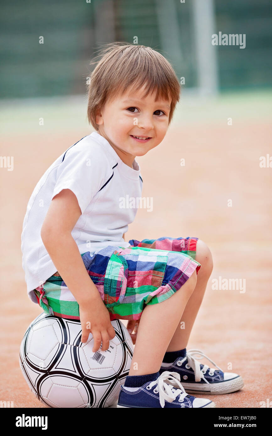 Cute little boy, playing football Stock Photo - Alamy