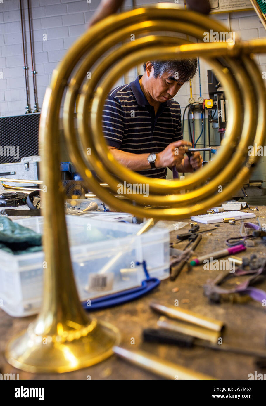 Japanese trumpeter Takashi Nakamura from Tokio works on his instrument ...