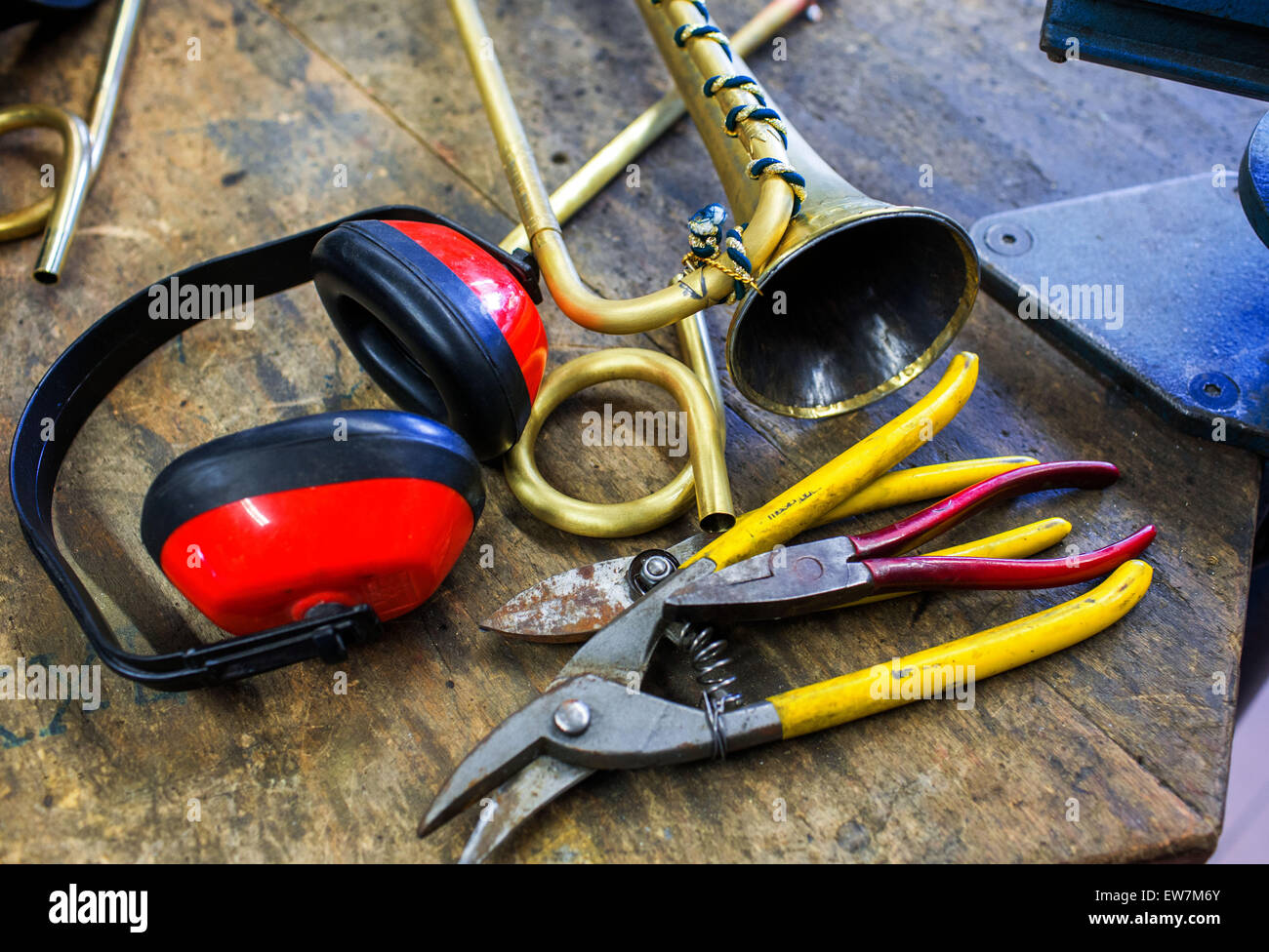 An almost-finished trumpet next to tools at the welding workshop of the ...