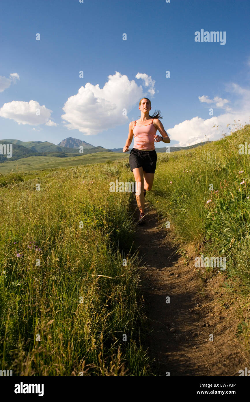 Woman trail running, Colorado Stock Photo - Alamy