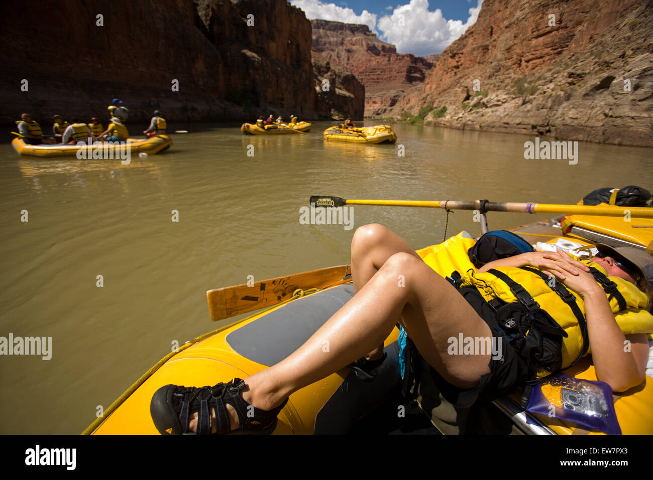 Person sleeping in a raft on a river in a canyon Stock Photo - Alamy