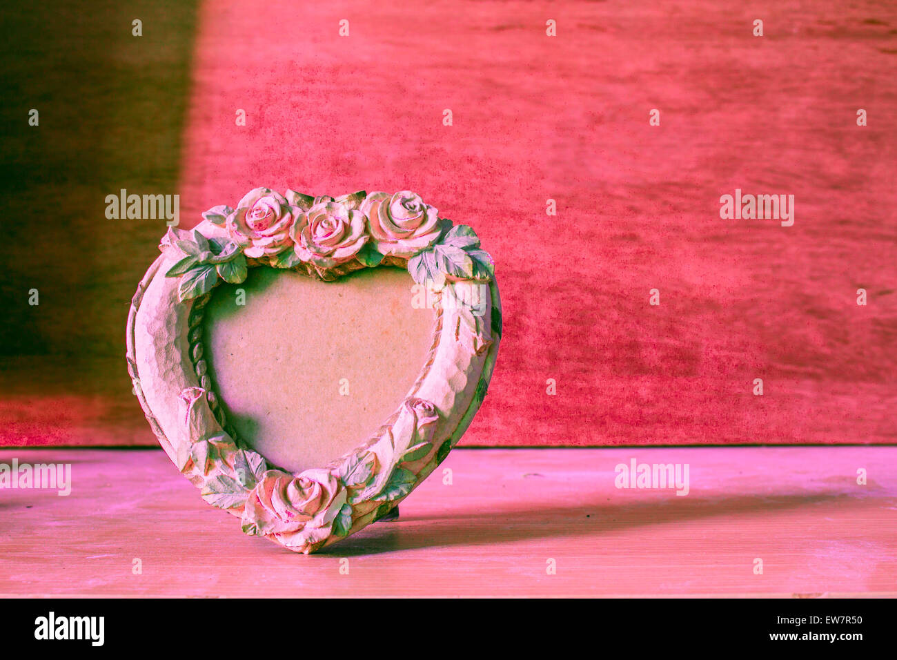 Heart shaped picture frame on the pink background Stock Photo - Alamy