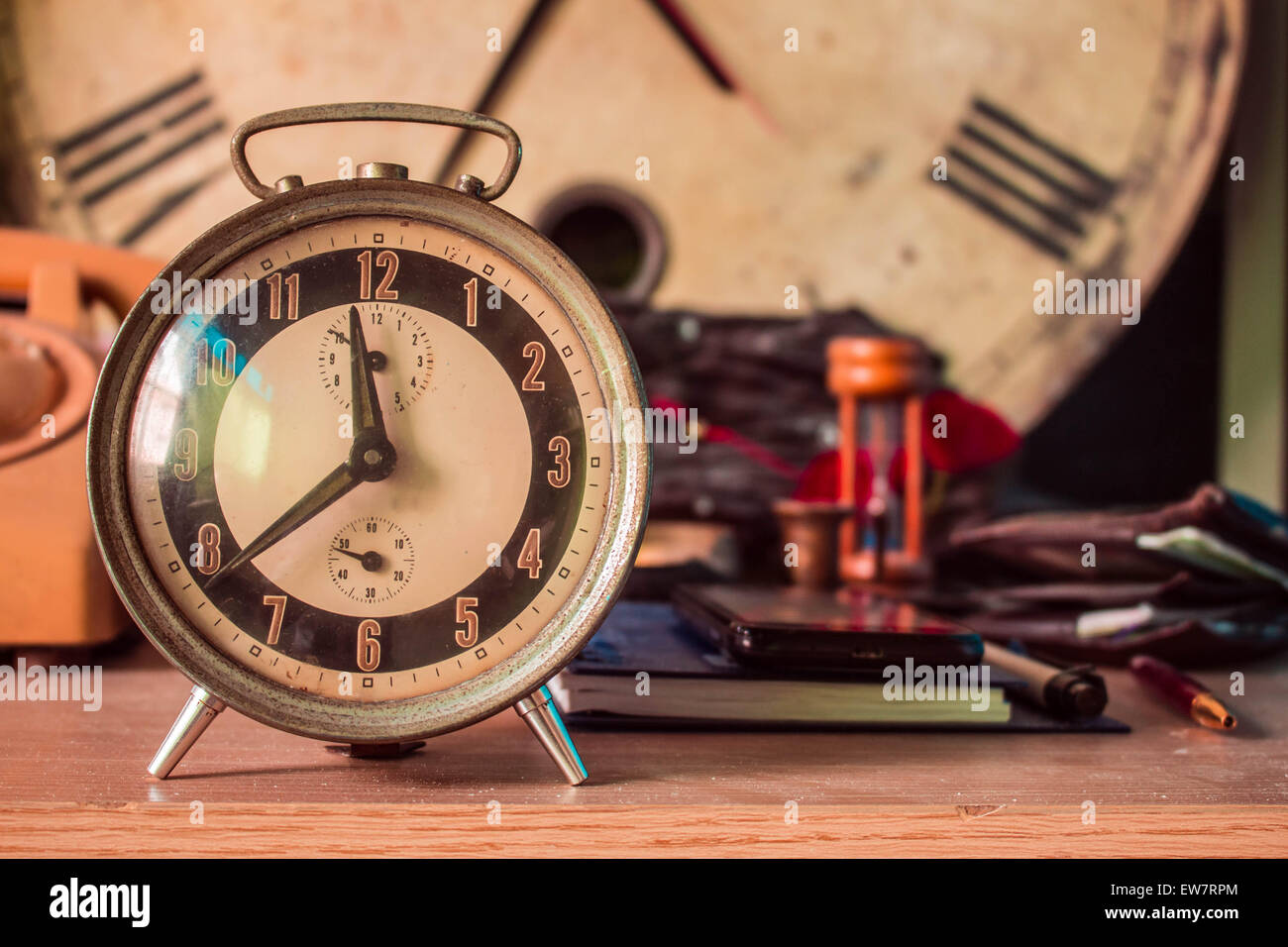 The old clock on the desk Stock Photo - Alamy