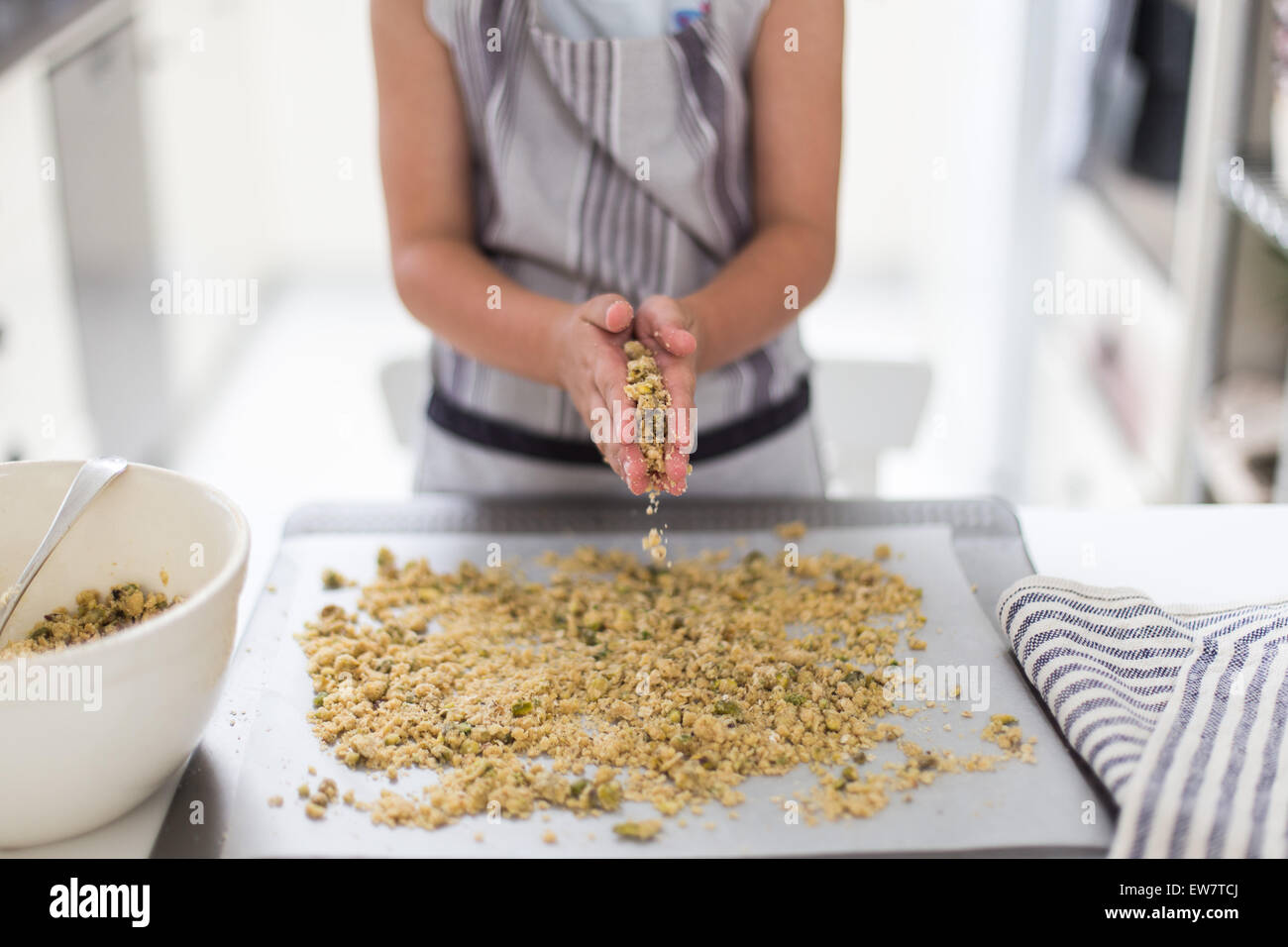 Girl making crumble Stock Photo - Alamy